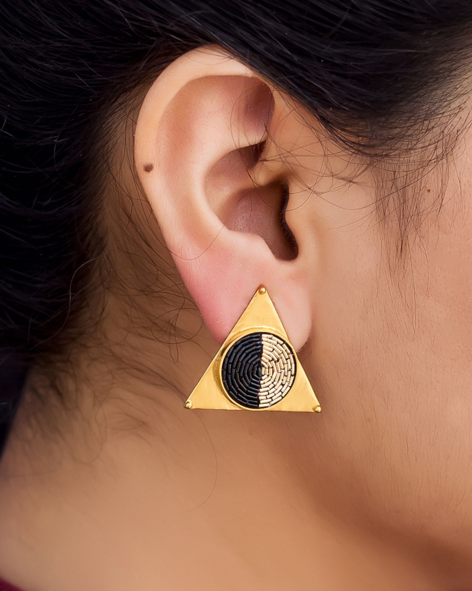 Black and golden triangular earrings by MissPrint | The Secret Label