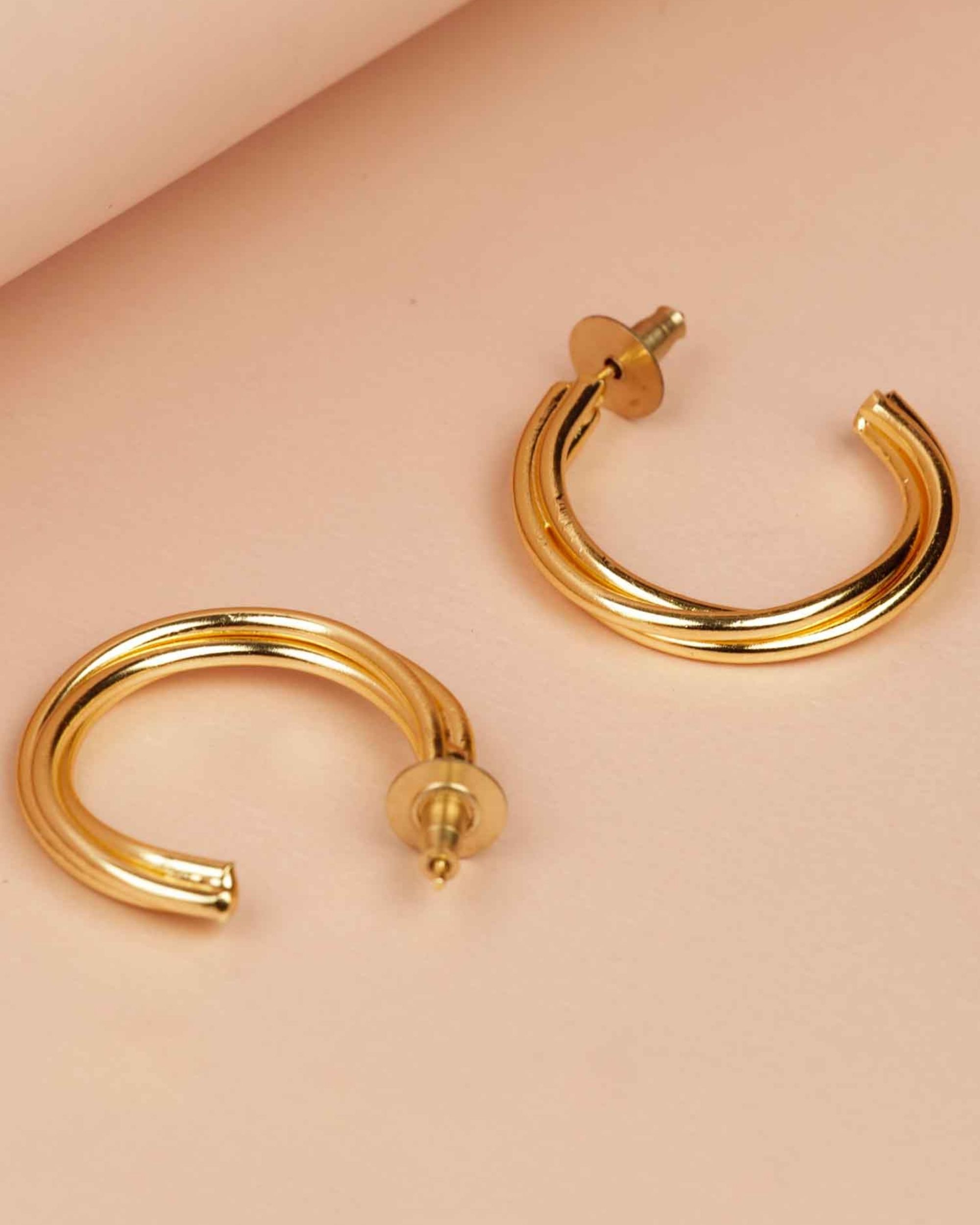 Twisted hoop earrings by Namasya | The Secret Label