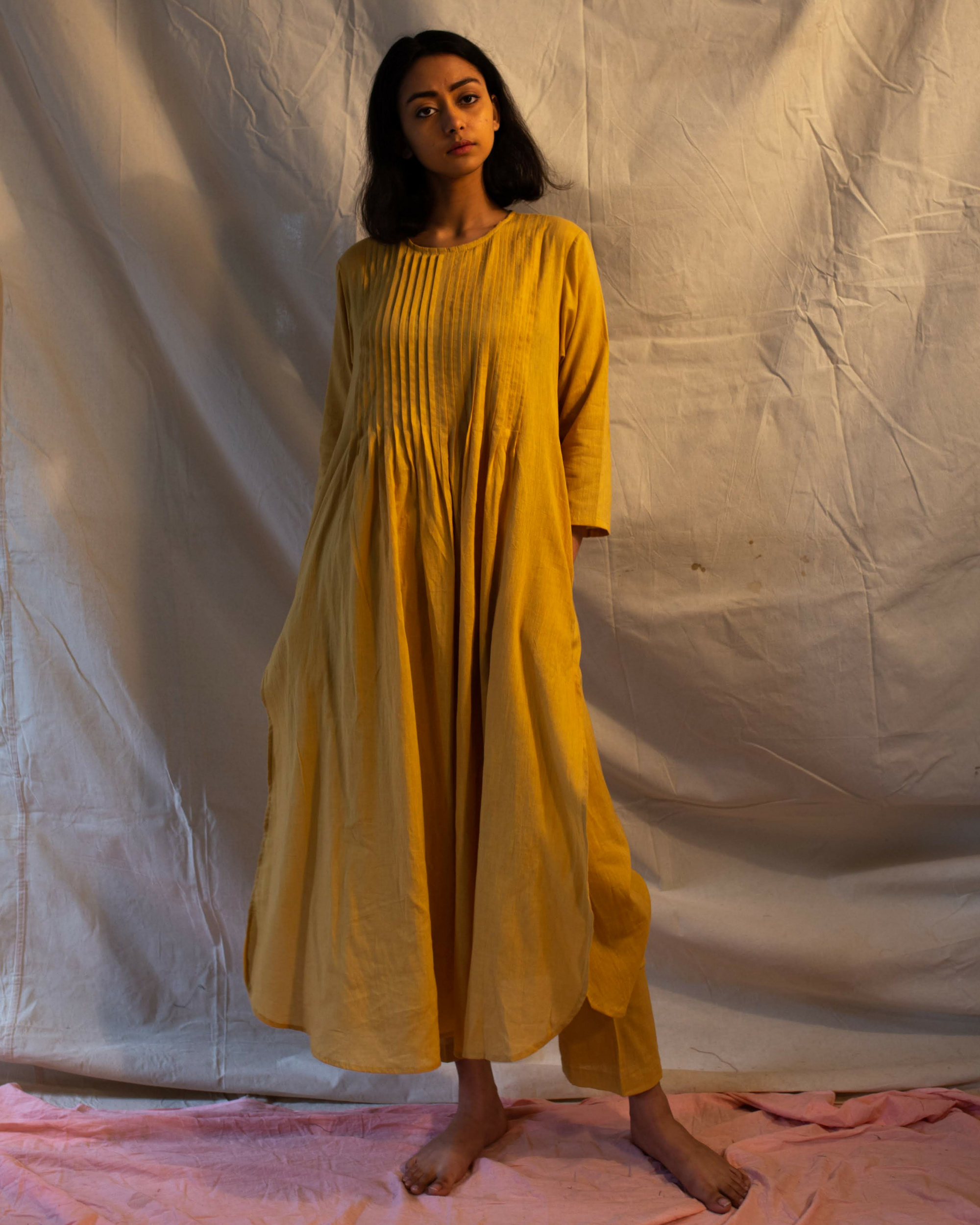 Mustard tuck front kurta set by Juanita | The Secret Label