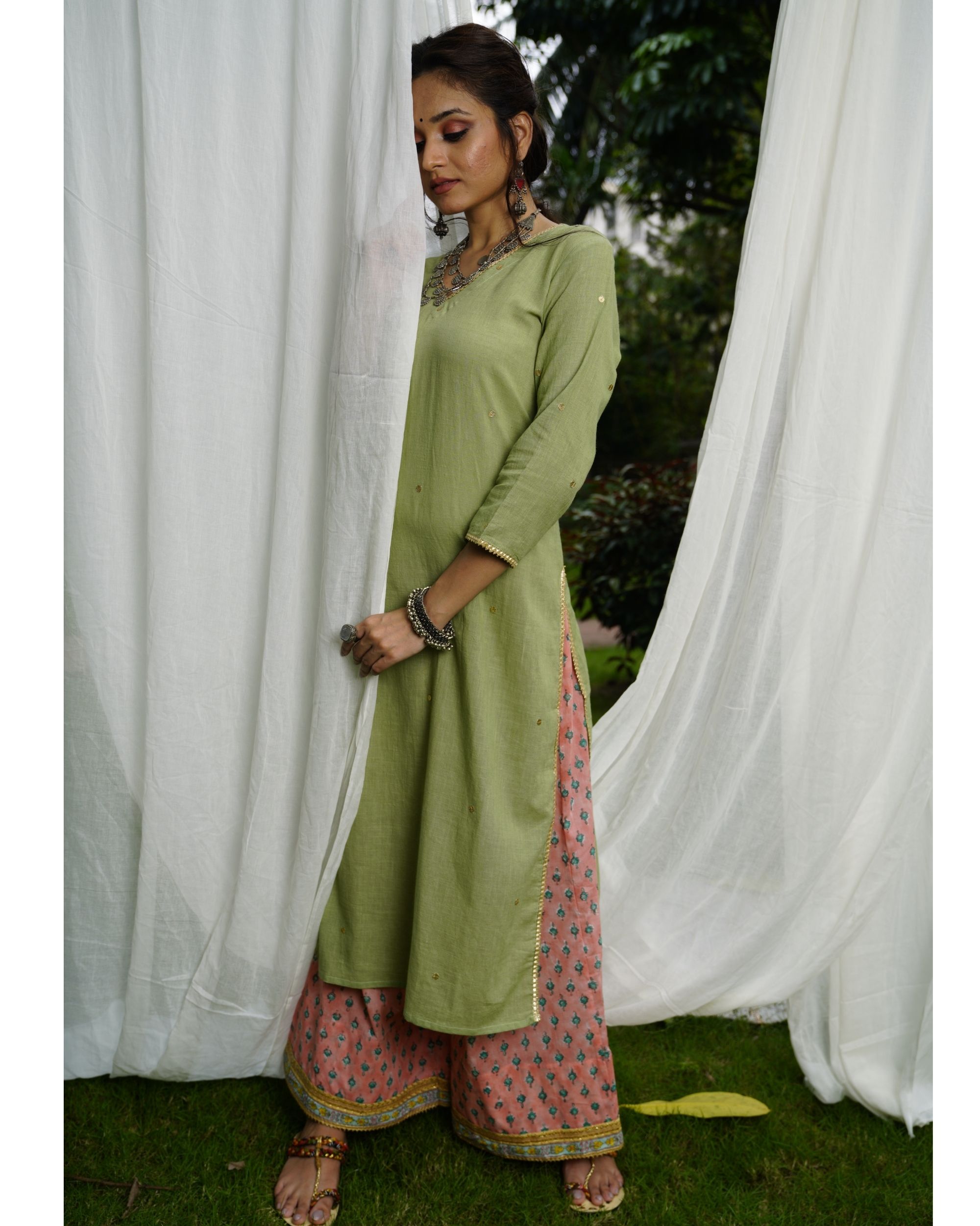 Pink block printed flared pants by Pants and Pajamas | The Secret Label