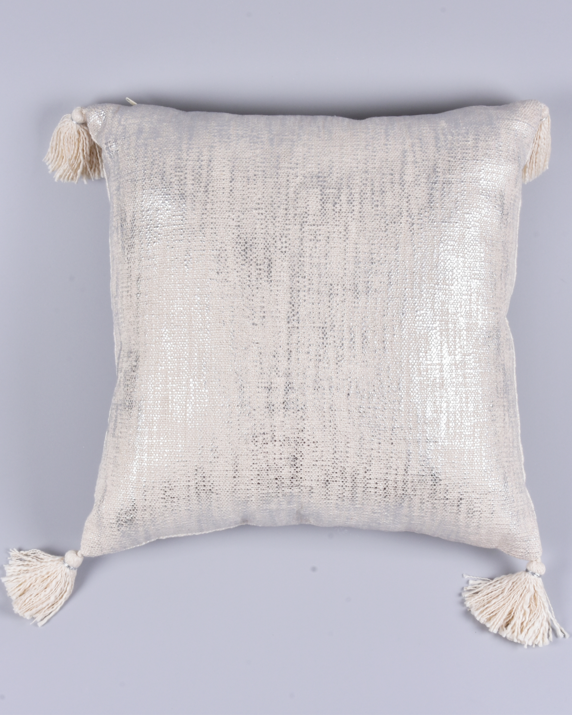 Cream and silver tasseled cushion cover by Skyy Living | The Secret Label