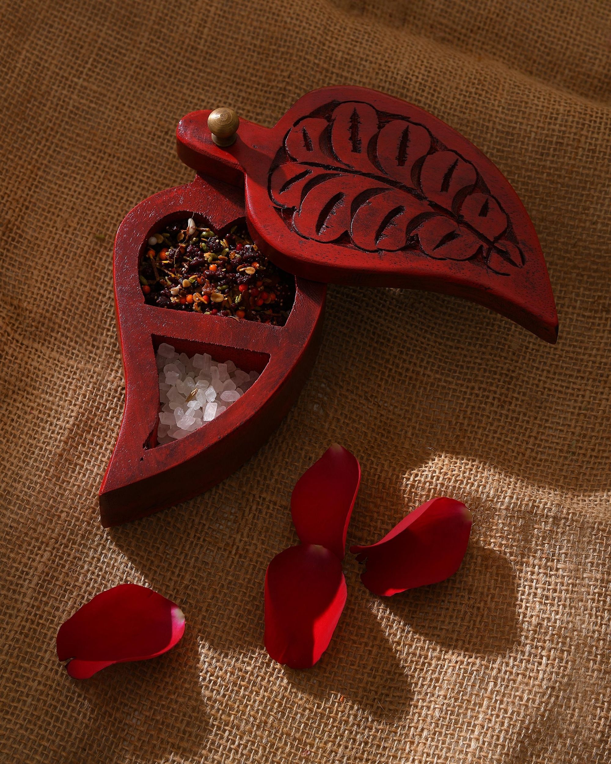 Red leaf shaped carved wooden box by Amoliconcepts | The Secret Label