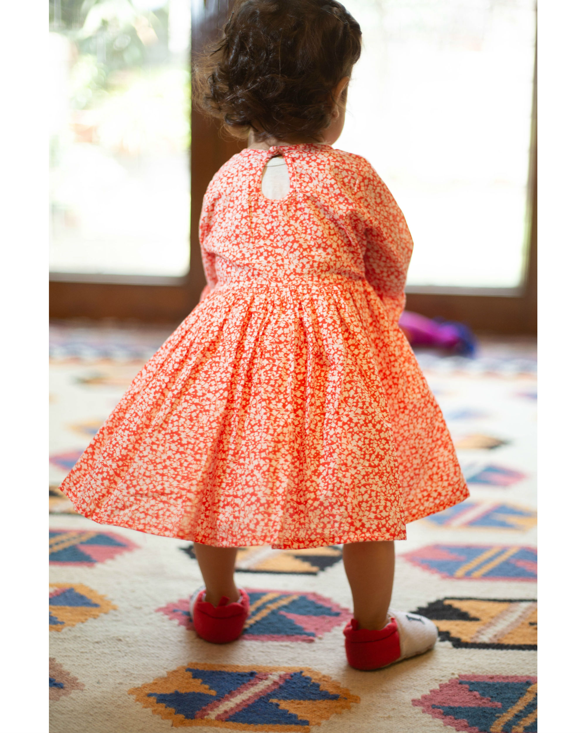Orange floral dress with ruffle sleeves by Raasleela | The Secret Label