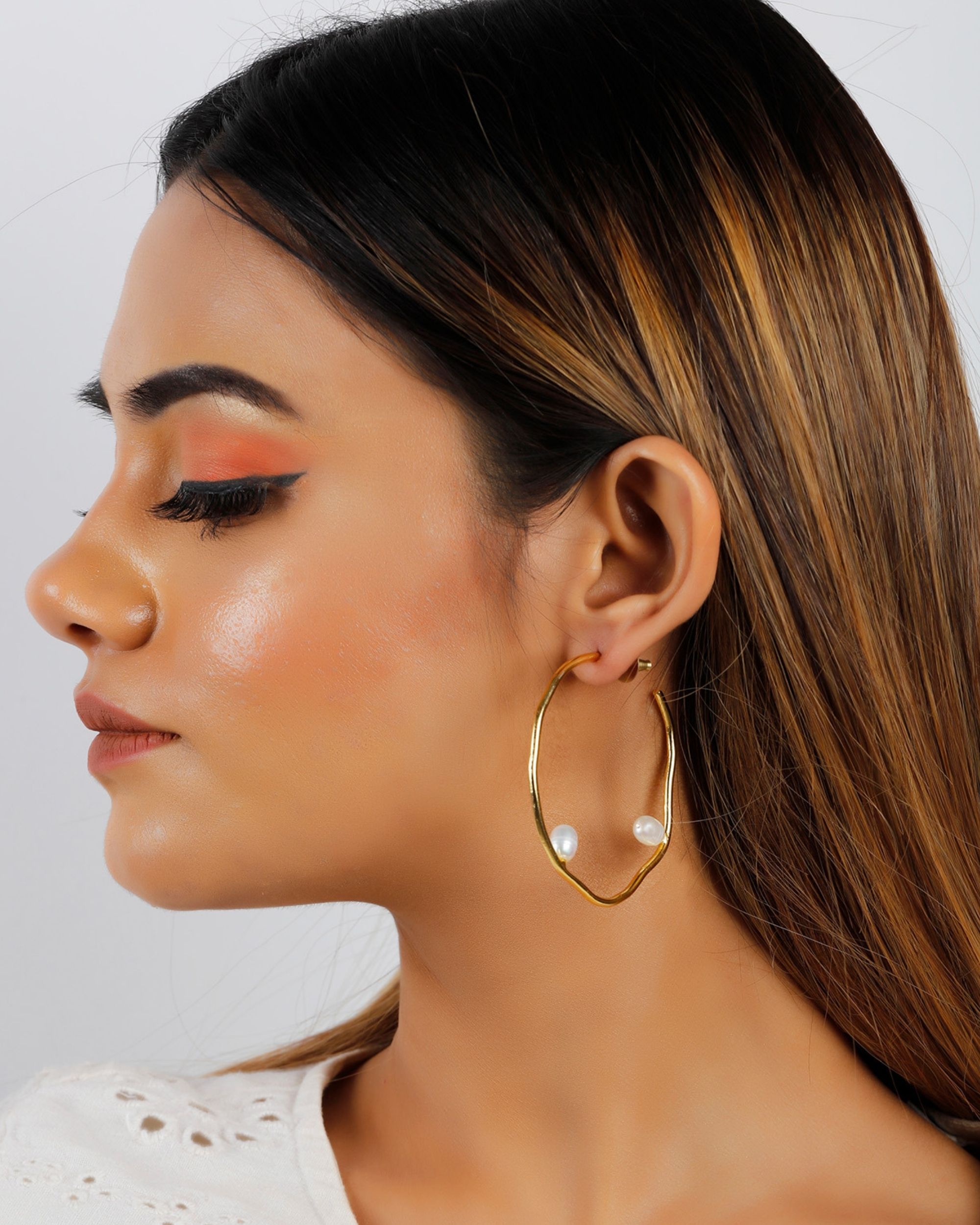 Pearl beaded curved hoop earrings by Namasya The Secret Label