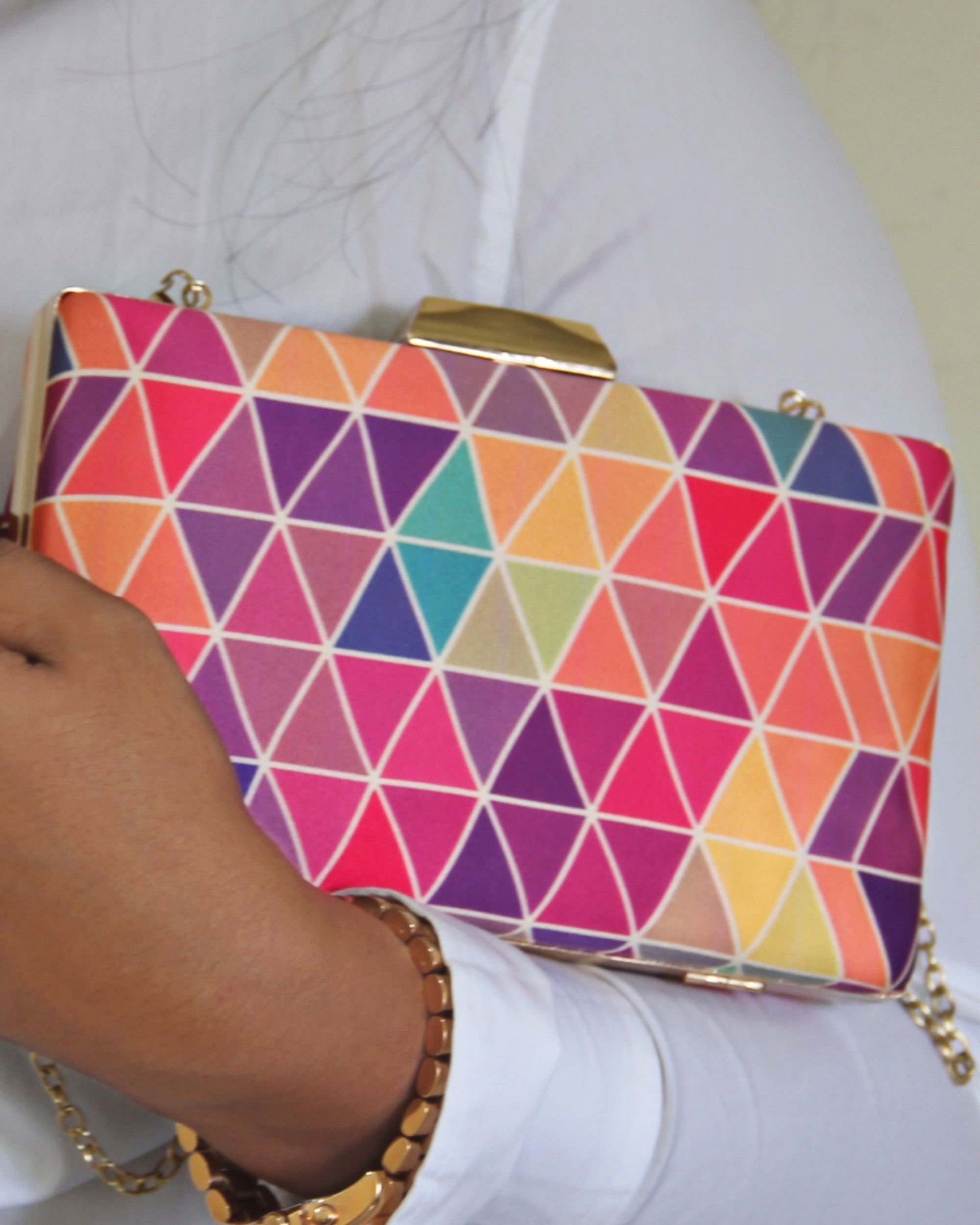 Multicolour triangle pattern printed clutch bag by Assortia | The ...